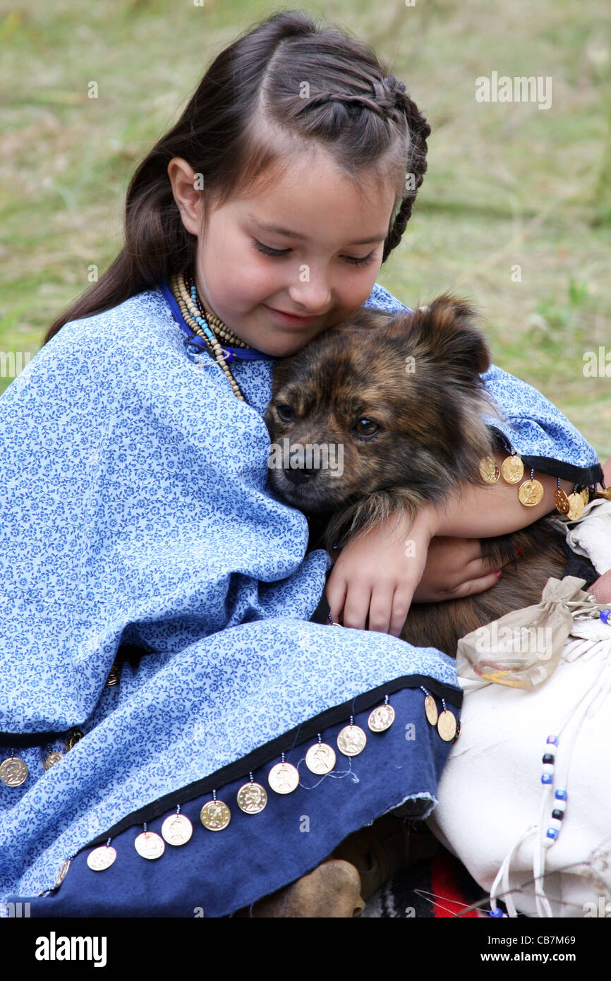 A Native American Indian girl hugging a dog Stock Photo - Alamy