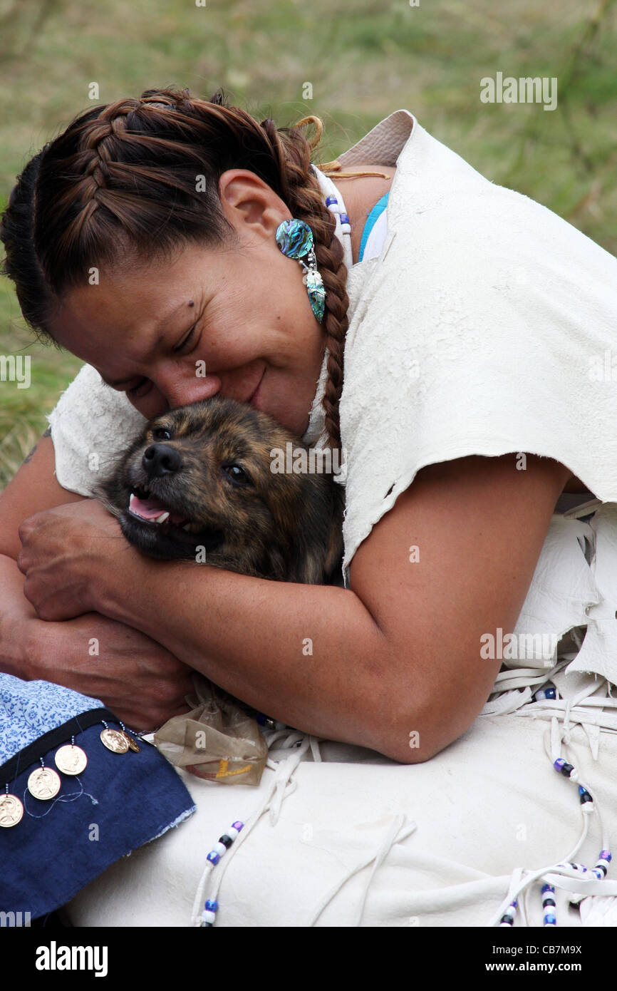 A Native American Indian woman hugging a dog Stock Photo - Alamy