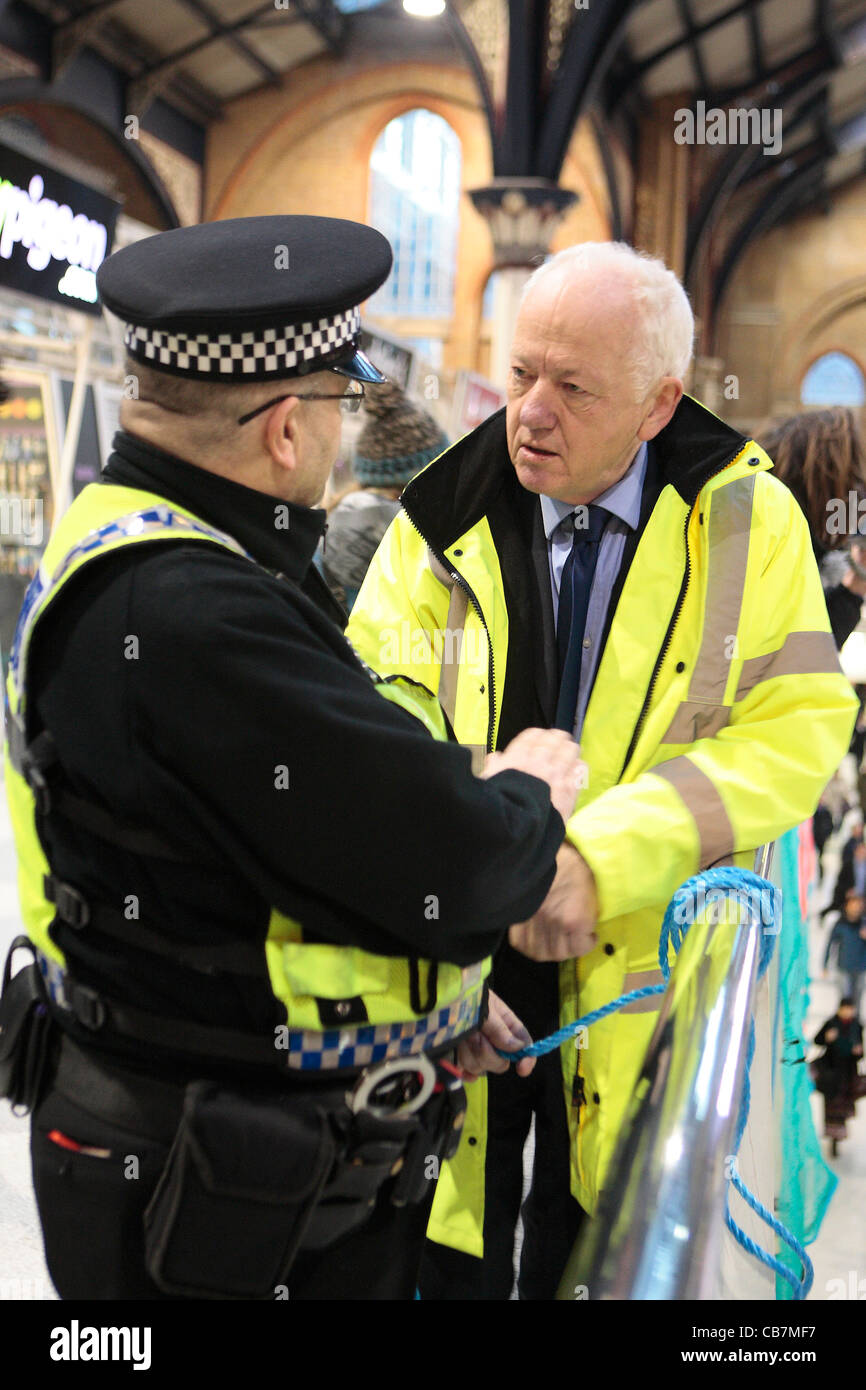 Activist Christ Knight and a police officer exchange words during a ...