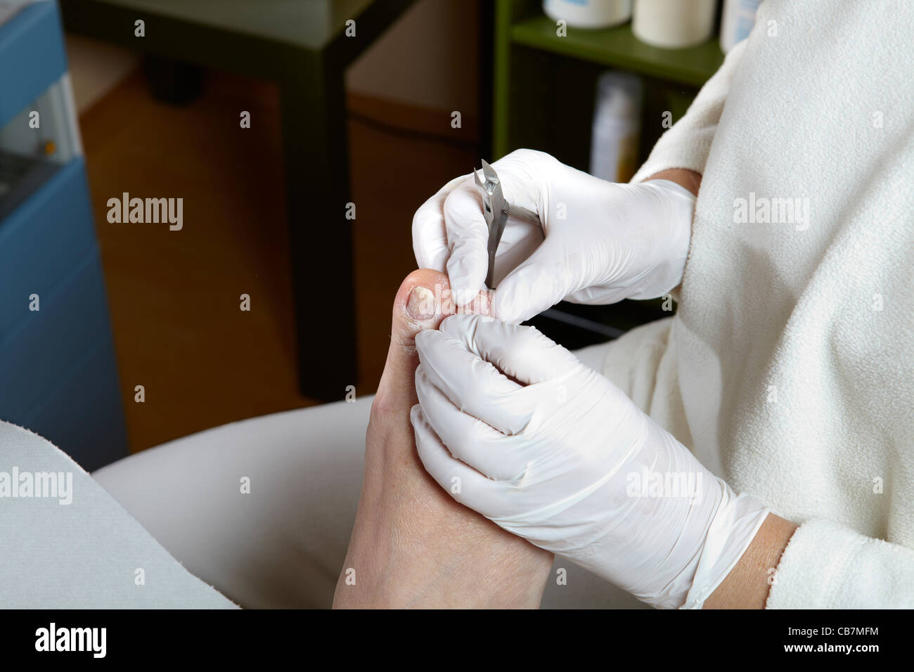A Podiatrist cut the toenails of a woman Stock Photo - Alamy