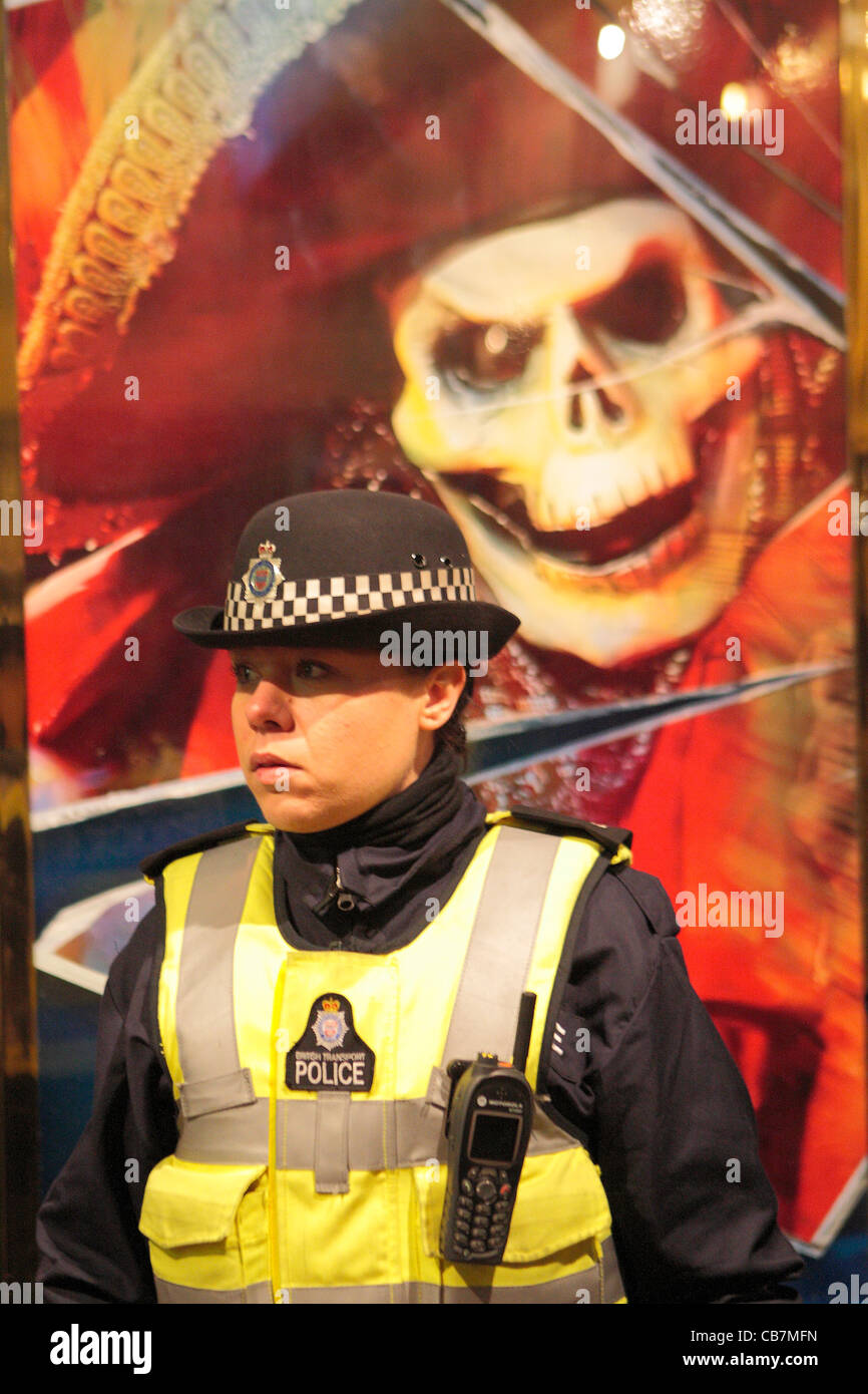 Female police officer with a theater poster backdrop Stock Photo - Alamy
