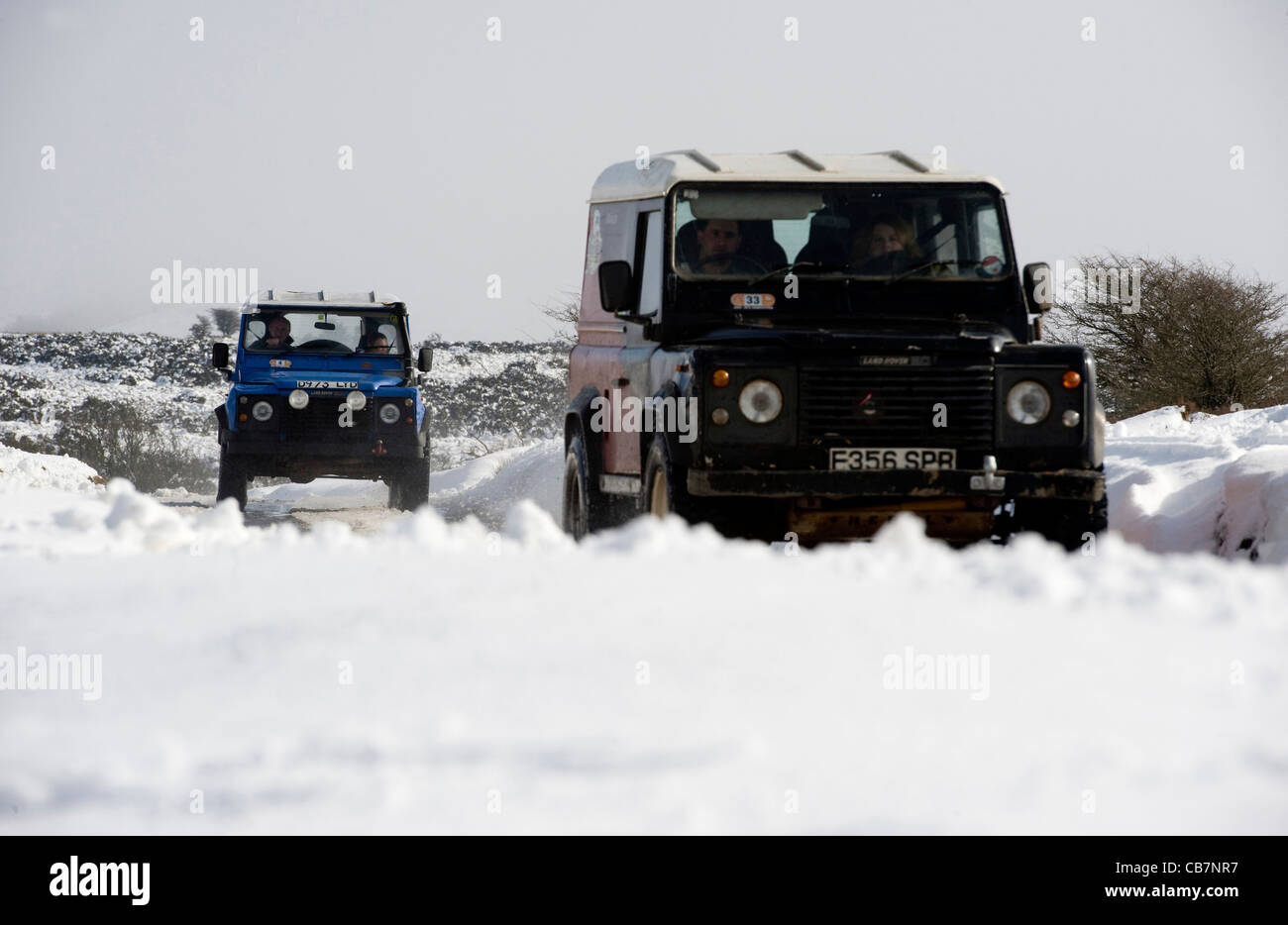 4 wheel drive land rover vehicles crossing Exmoor in the snow Stock ...