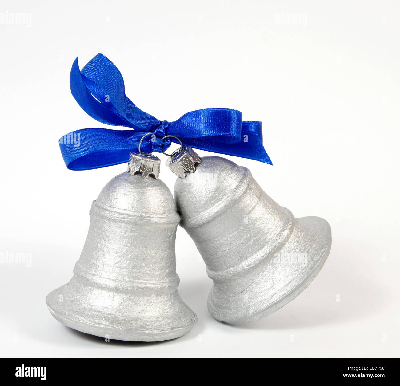 Two silvery bells on the white background Stock Photo - Alamy