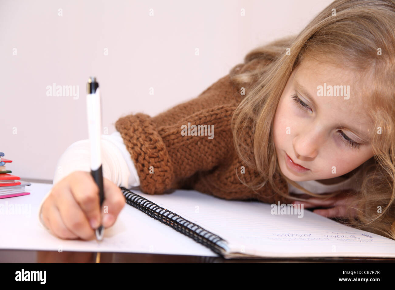schoolgirl doing homework, lessons, read books, school Stock Photo - Alamy