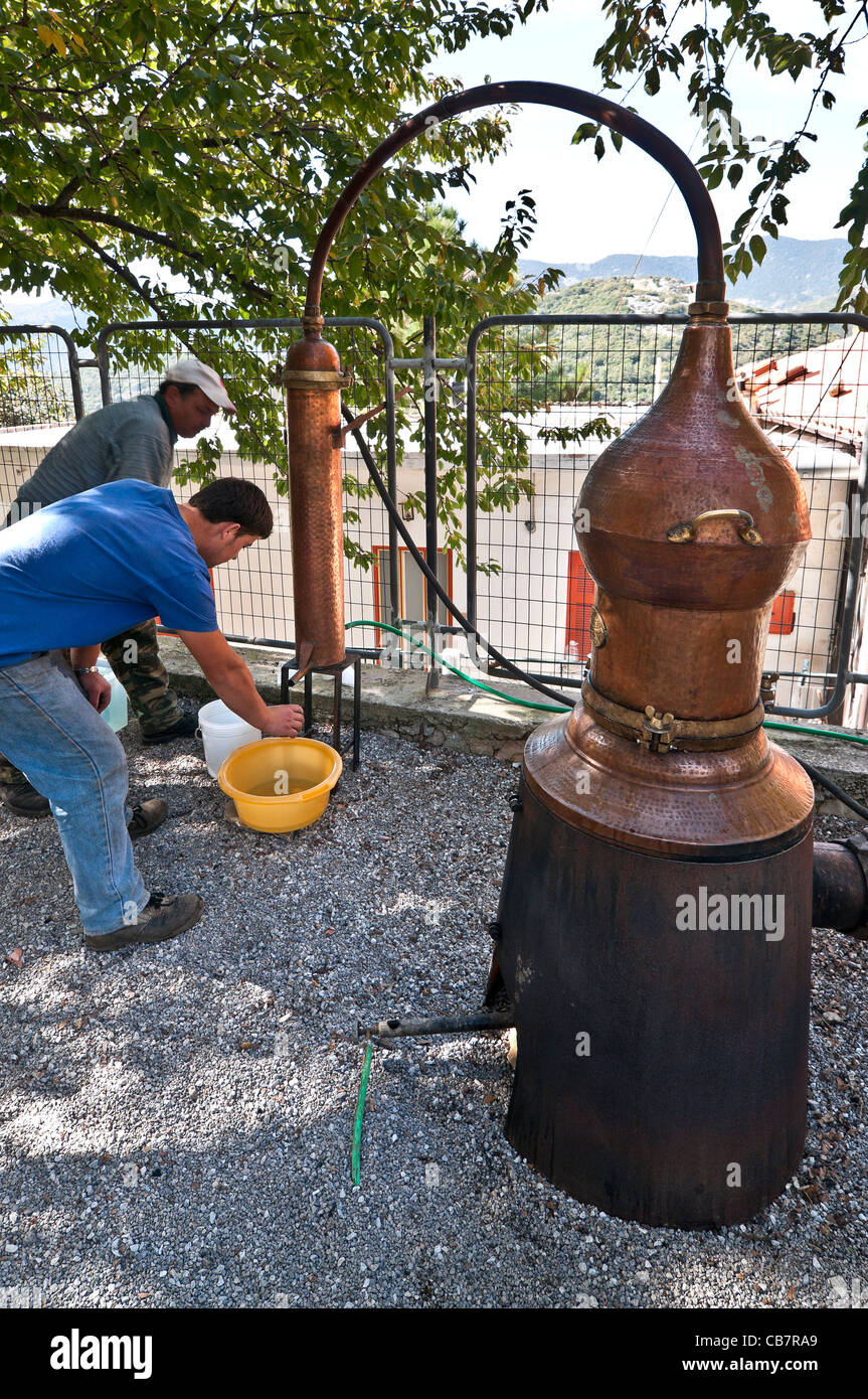 A copper still producing Tsipouro, a traditional Greek, spirit, at the ...