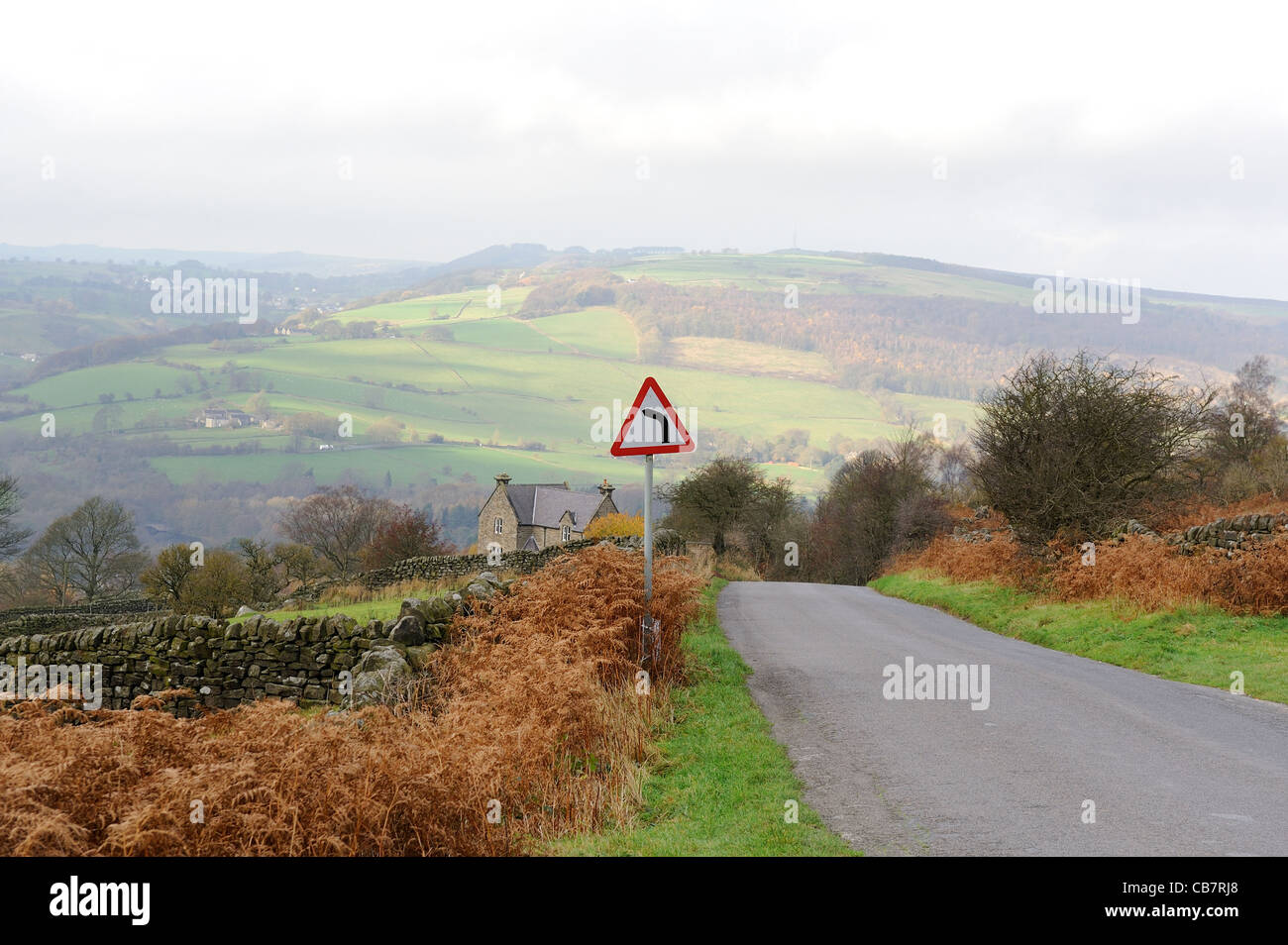 autumn roadside scene with left bend sign curbar derbyshire peak ...