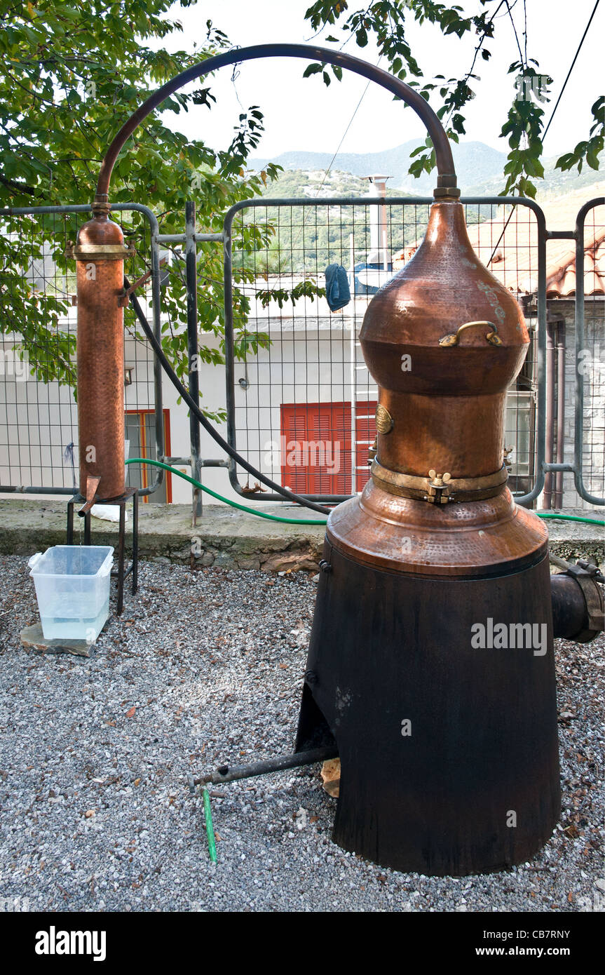 A copper still producing Tsipouro, a traditional Greek, spirit, at the ...