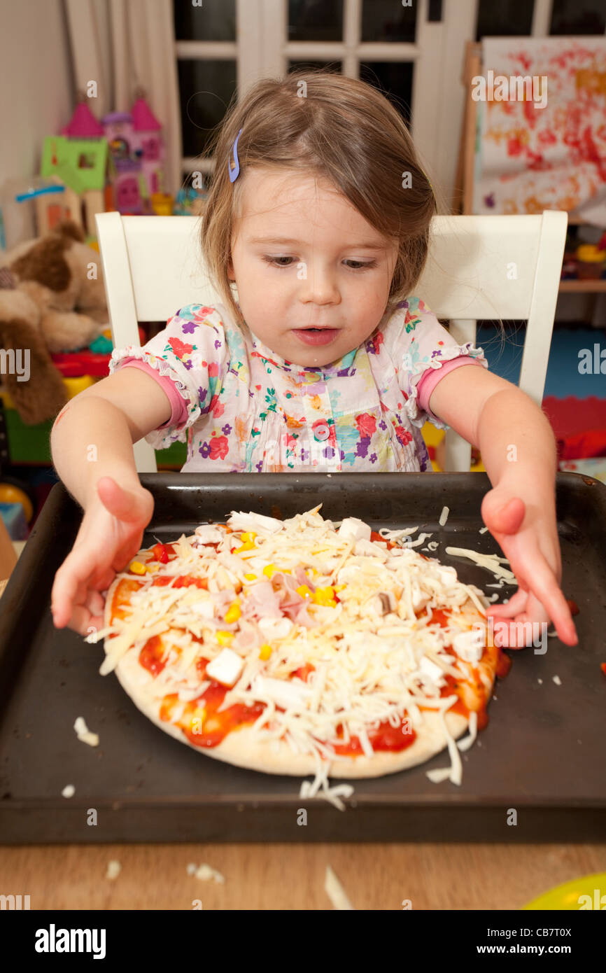 young girl preparing homemade pizza Stock Photo - Alamy
