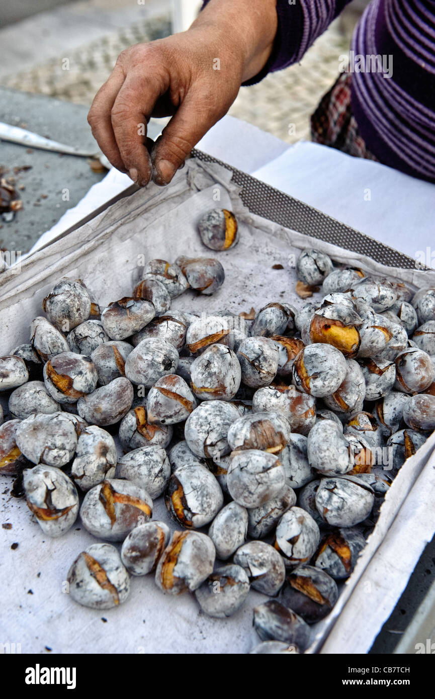 Roasted chestnuts seller hi-res stock photography and images - Alamy