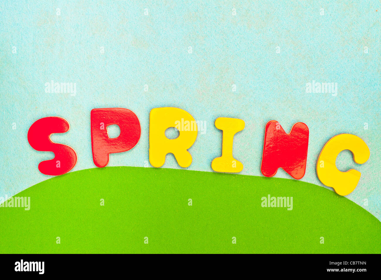 vibrant textured background of spring colours and spring in letters ...