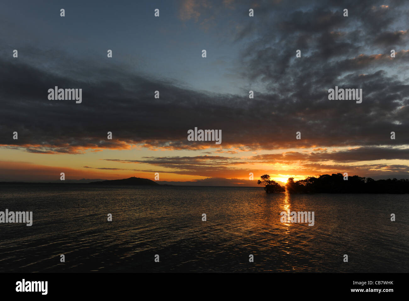 sunset over sea and mangroves at Cockle Bay, Magnetic Island ...