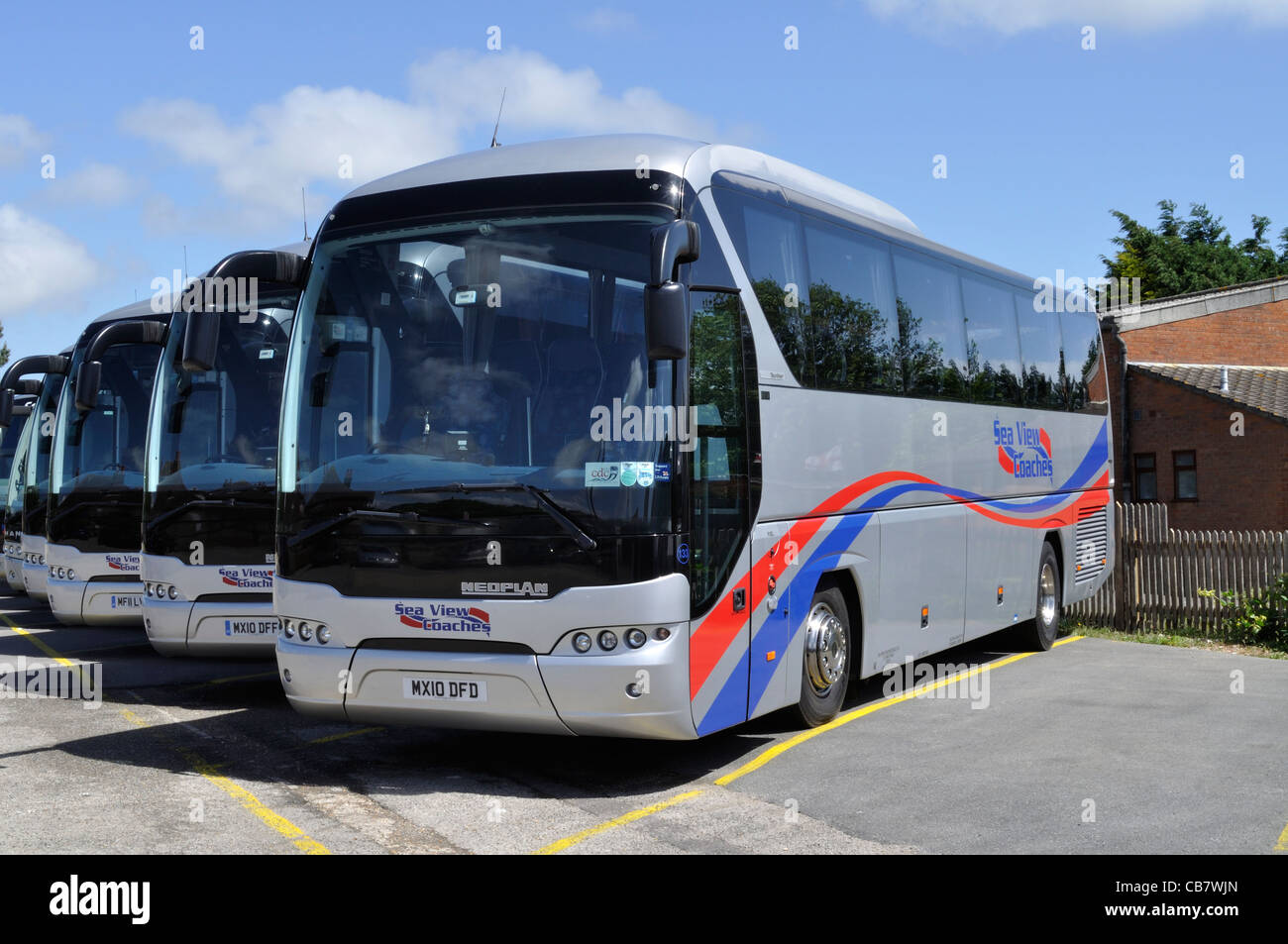 A line up of Seaview Coaches vehicles at Poole. All are Neoplan bodies ...