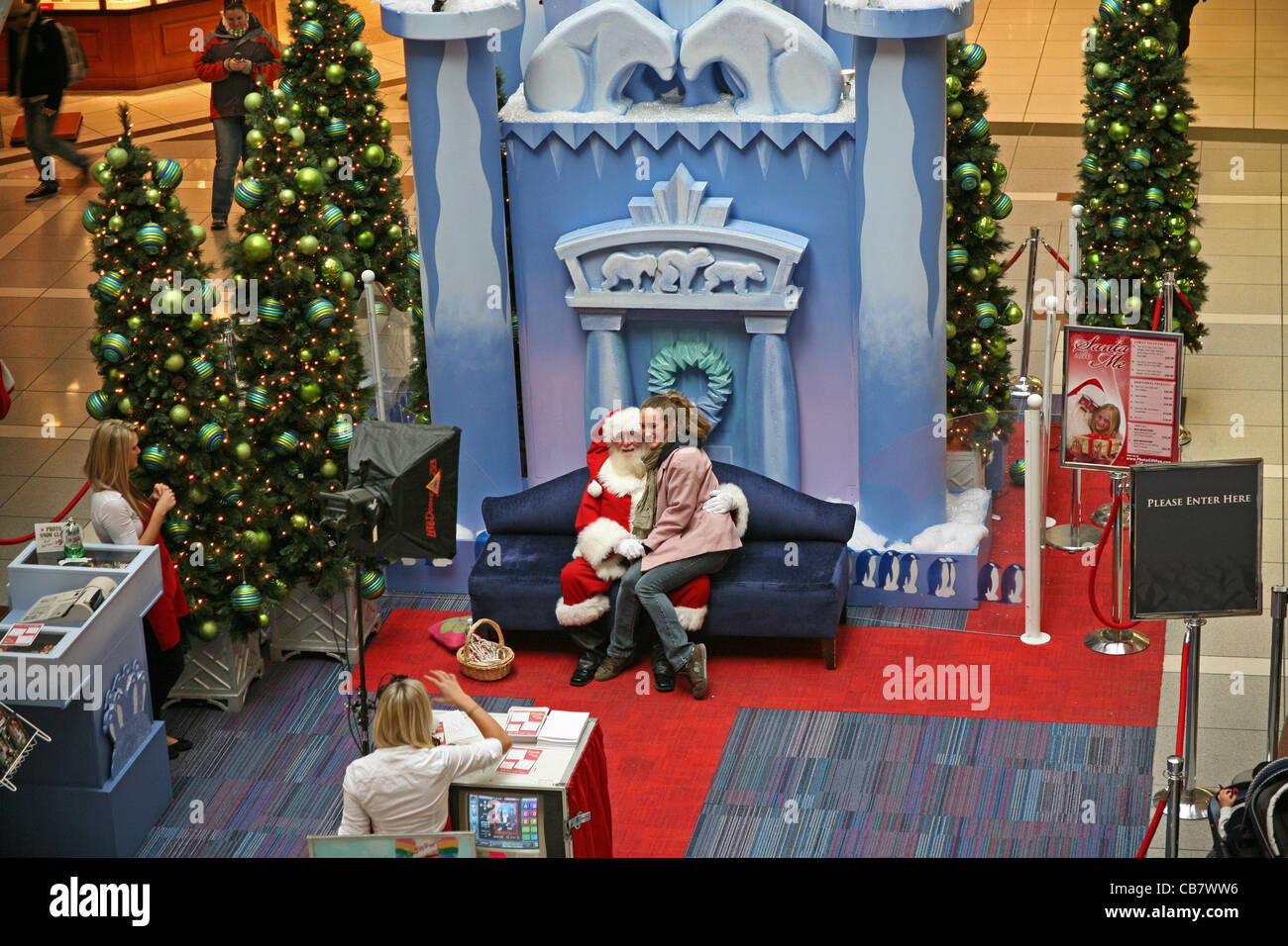 Shopping mall Santa Claus with a big girl Stock Photo - Alamy