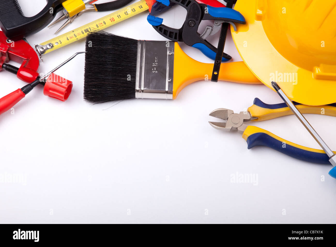 a mix of construction tools over a white background Stock Photo - Alamy