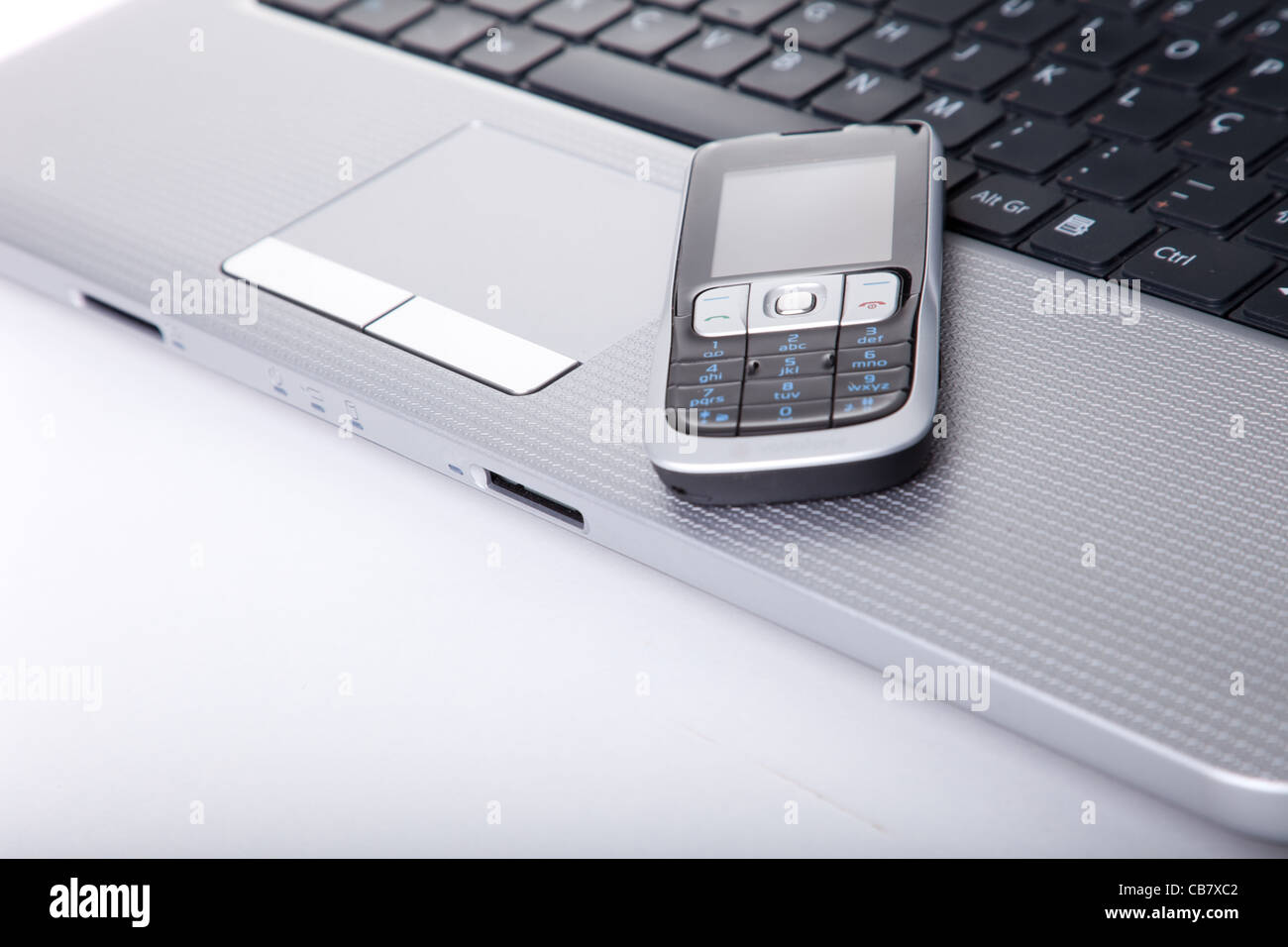 business laptop and cellphone at the office Stock Photo - Alamy