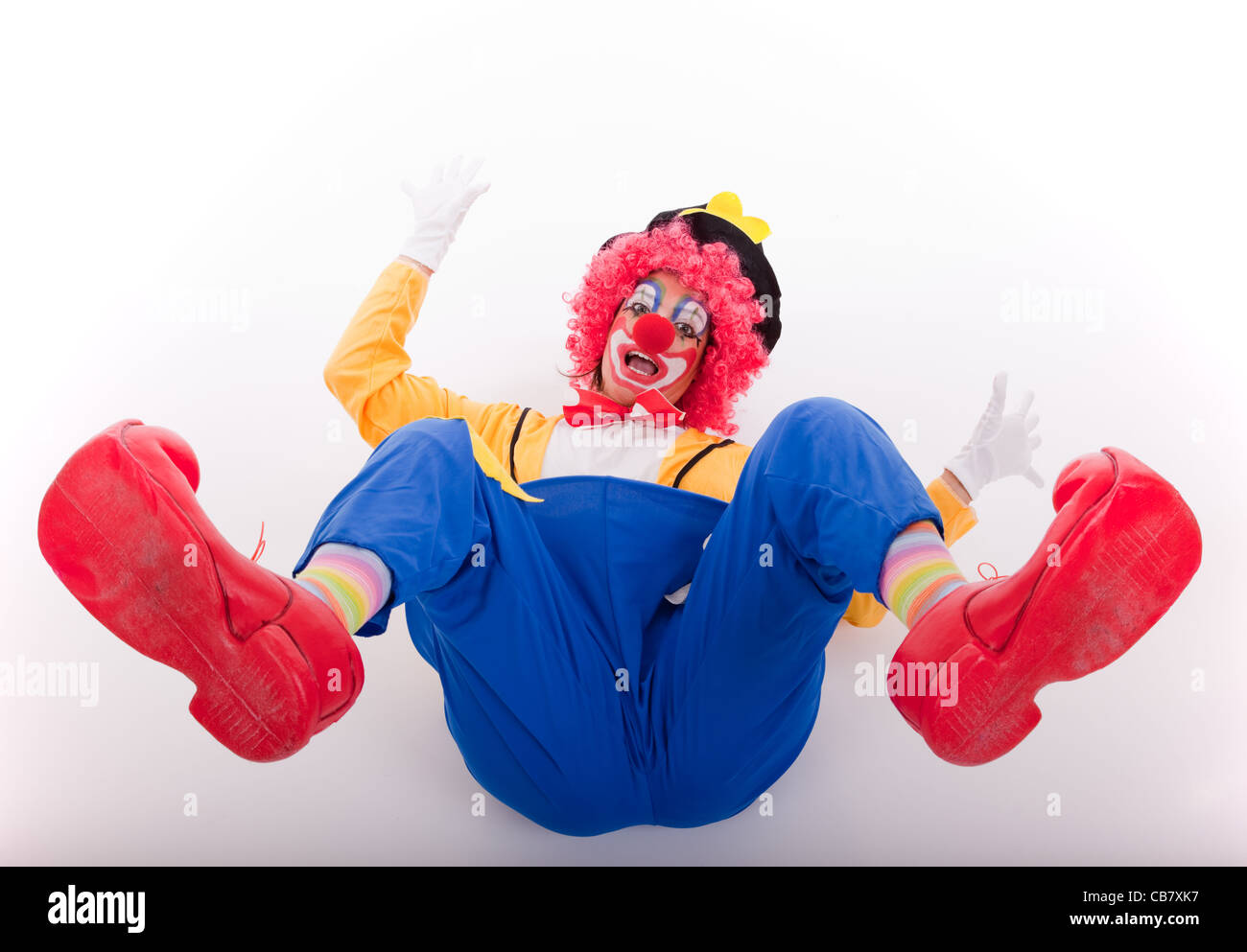 funny circus clown falling on the floor (isolated on white Stock Photo ...