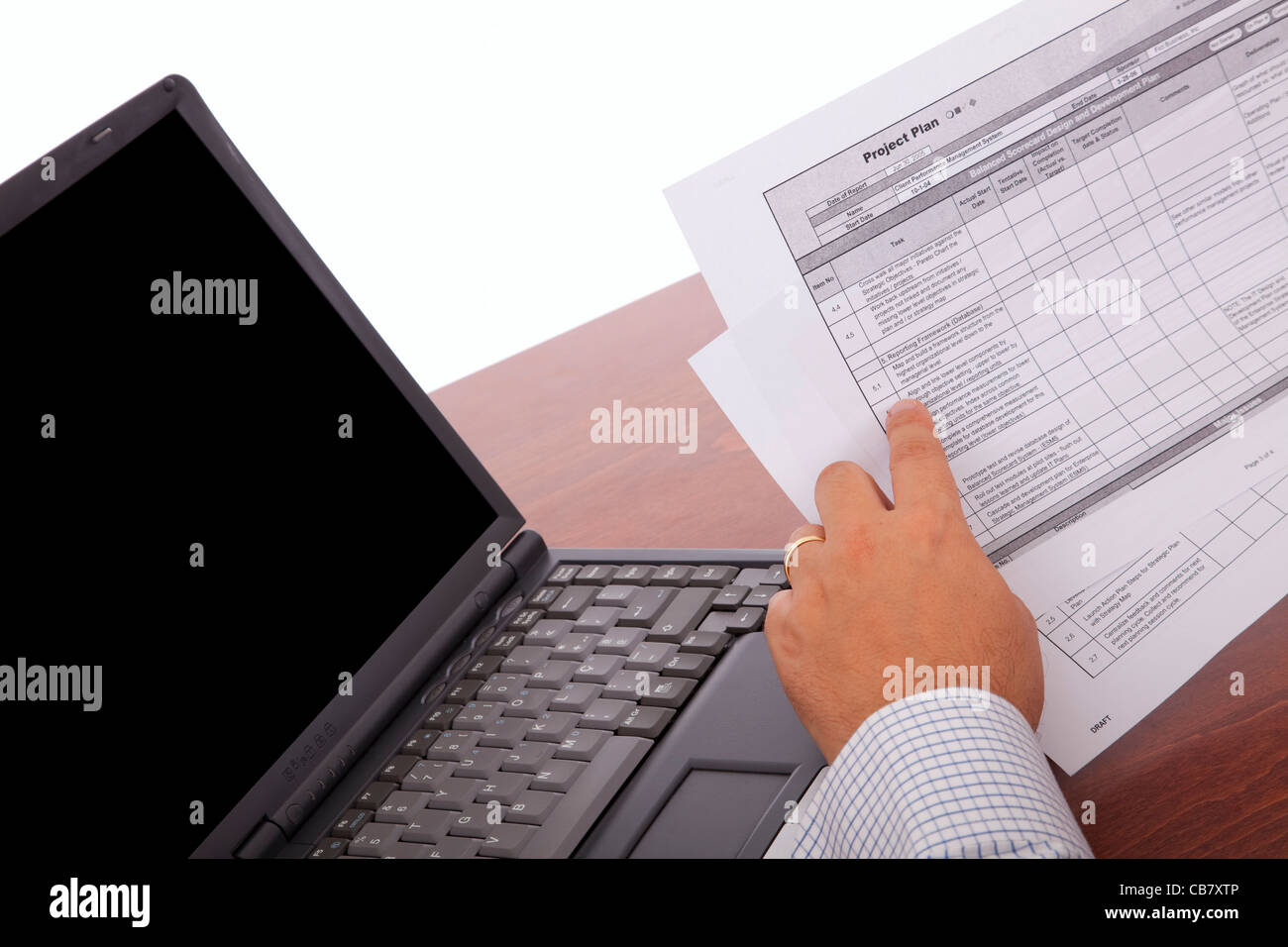 businessman reviewing the project at his office Stock Photo - Alamy