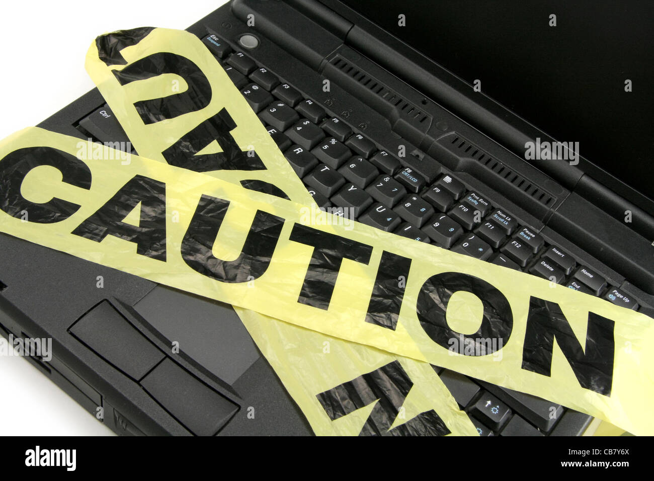 plastic caution tape and keyboard, computer crime Stock Photo - Alamy