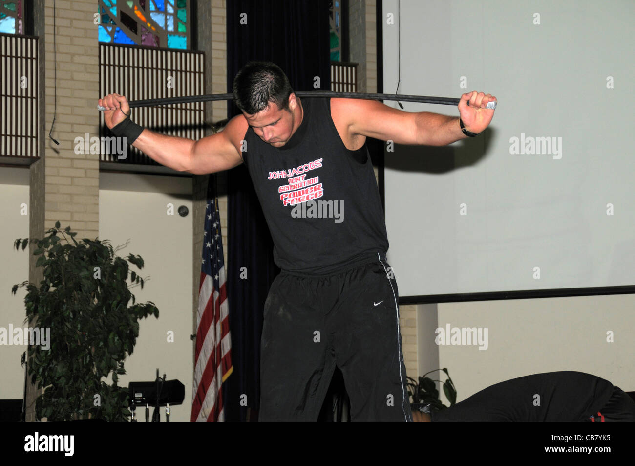 Man bends an iron bar during a power lifting show in Lahnam, Maryland ...