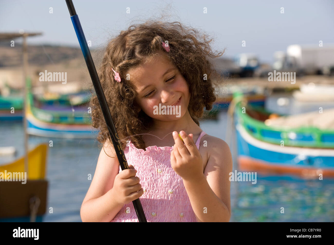 Malta: child's first attempt at fishing Stock Photo - Alamy