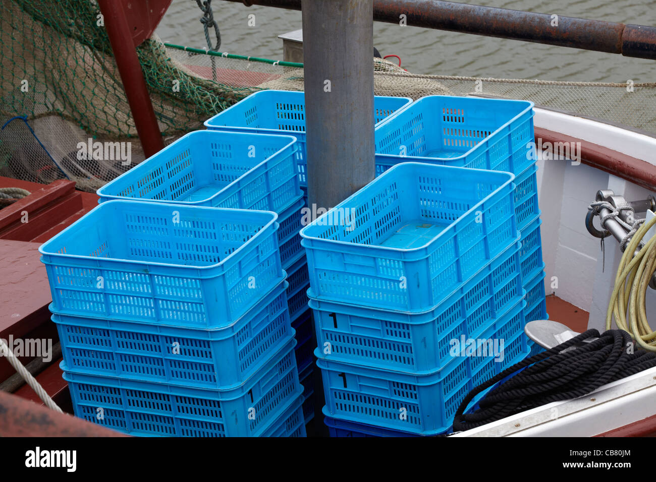 View of some fish boxes on a shrimp cutter Stock Photo - Alamy