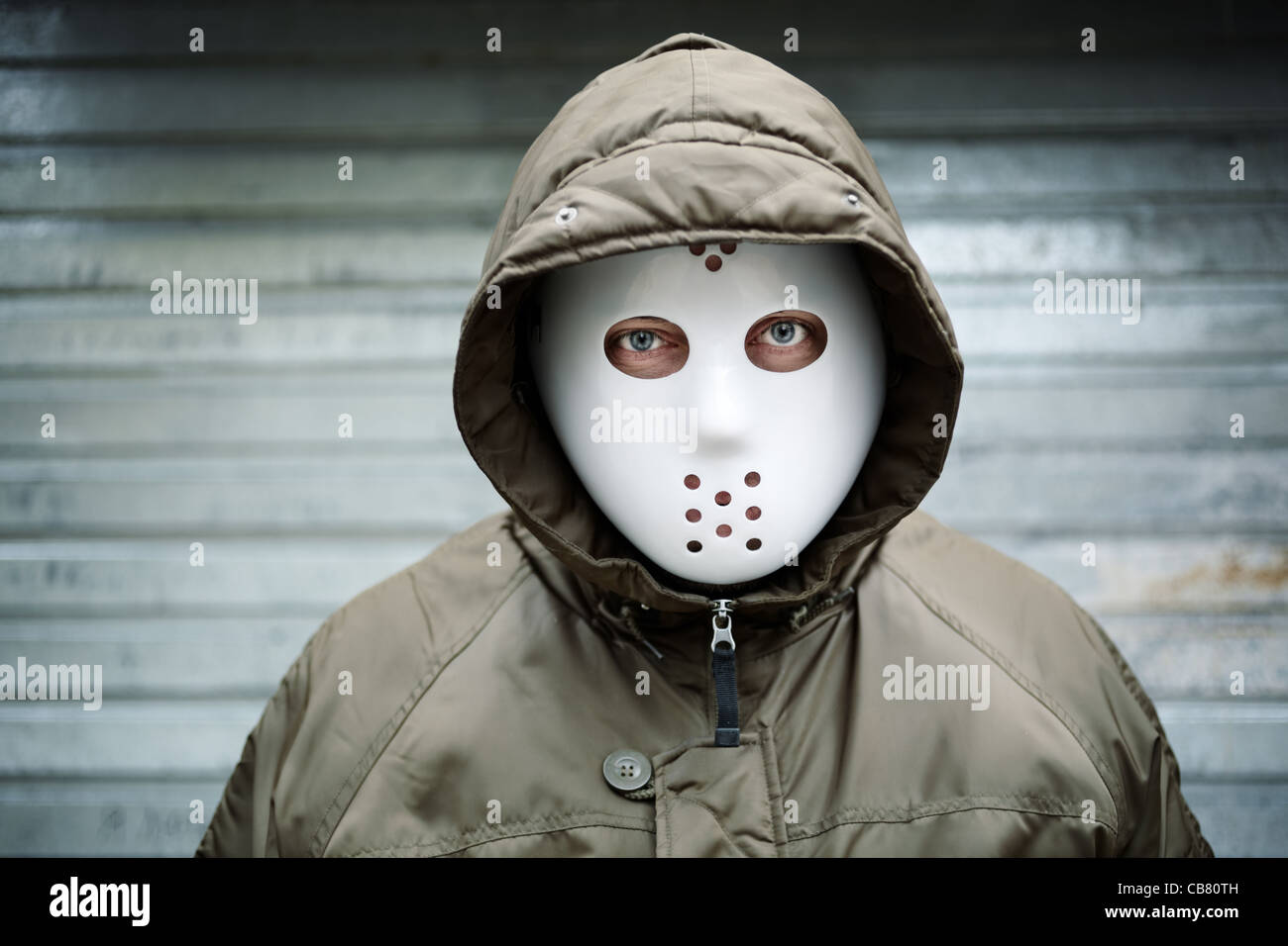 Spooky man with mask on the street Stock Photo - Alamy