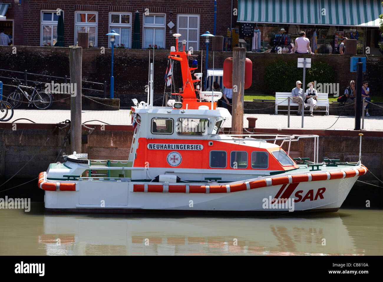 Rescue boat in the harbor basin of Neuharlingersiel on the North Sea ...