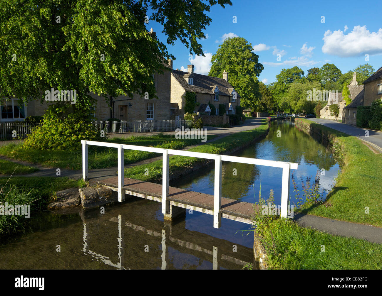 River Eye flowing through the pretty english village of Lower Slaughter ...