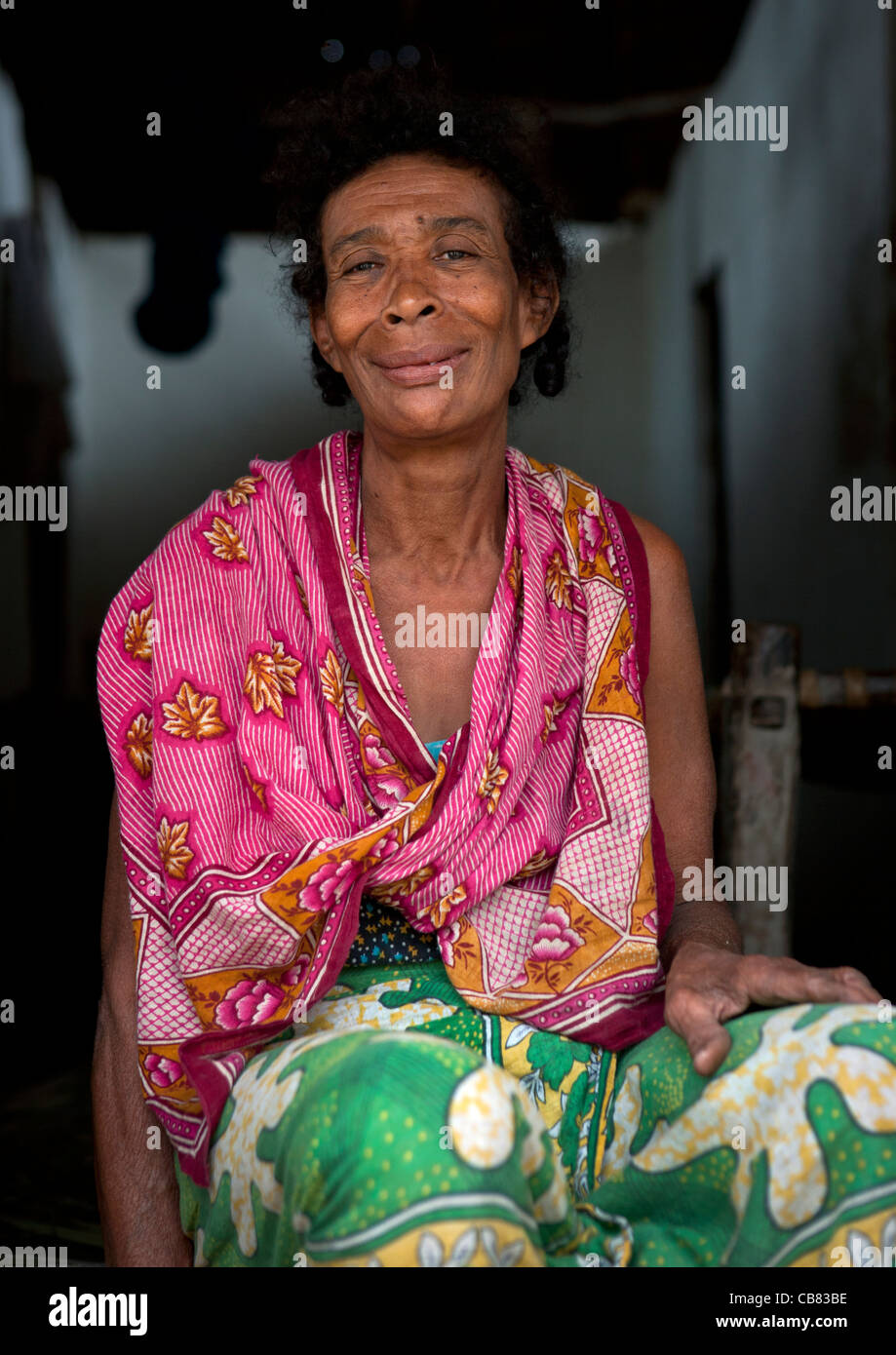 Woman With Colorful Dressing Sitting In Her House, Siyu, Pate Island ...