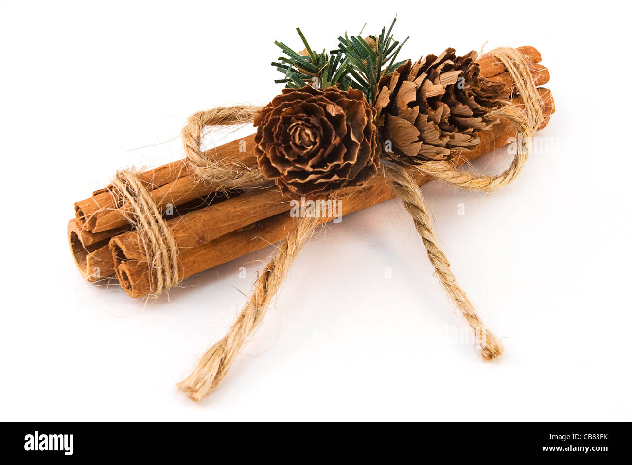Festive Cinnamon stick decoation on white Stock Photo - Alamy