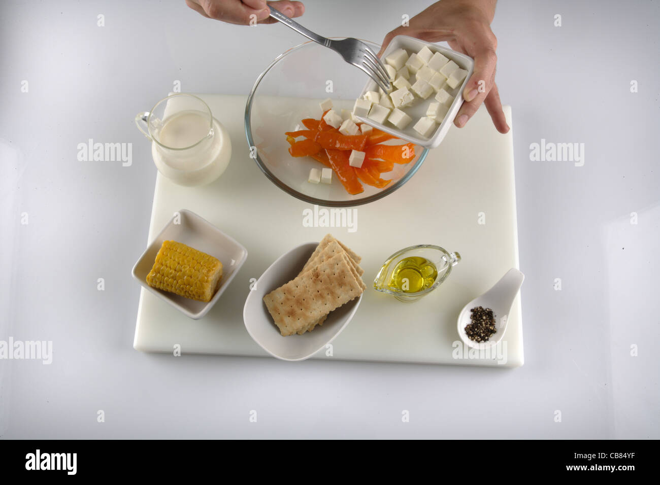 Adding diced cheese Stock Photo - Alamy