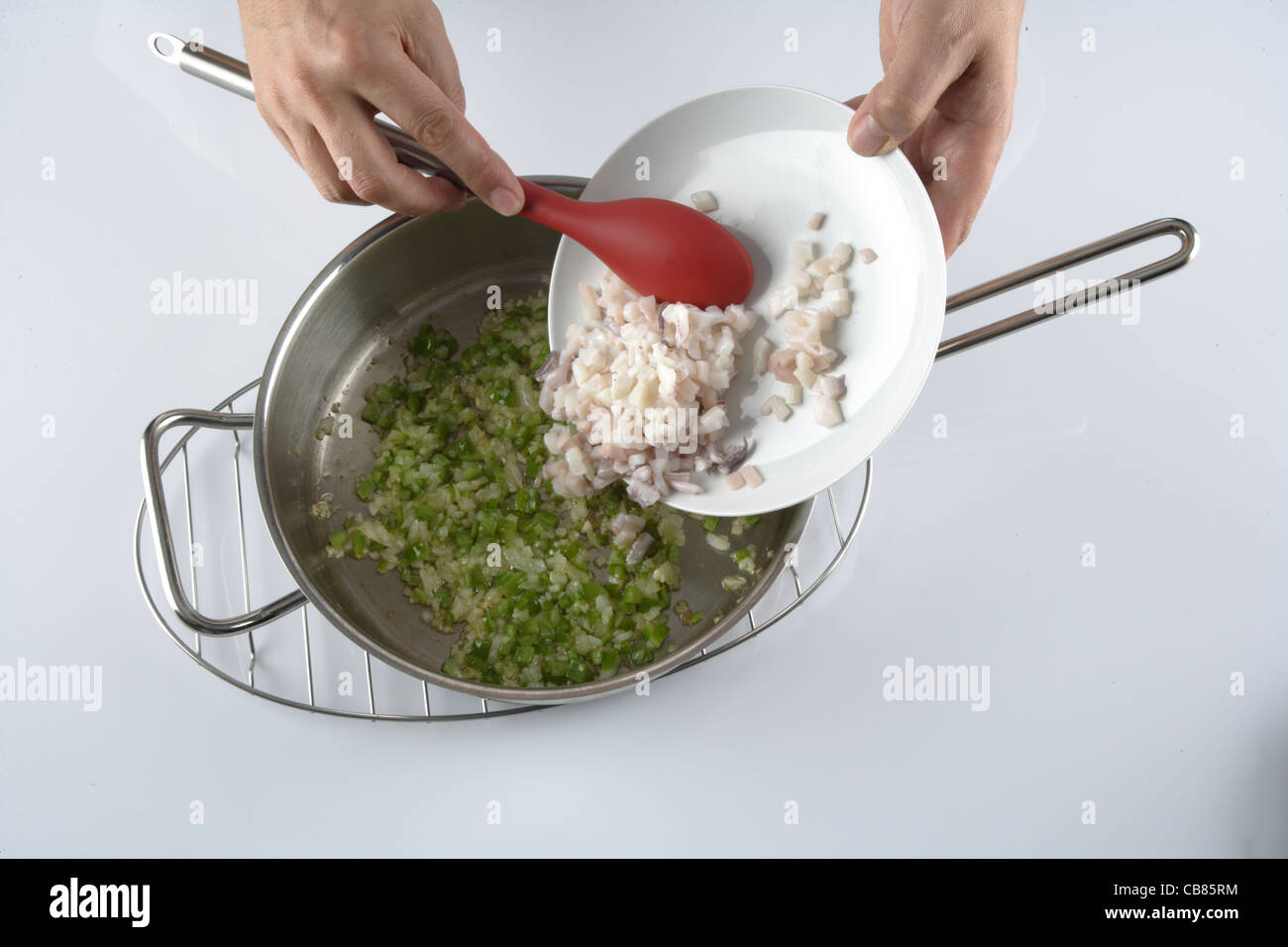 Adding green peppers hi-res stock photography and images - Alamy