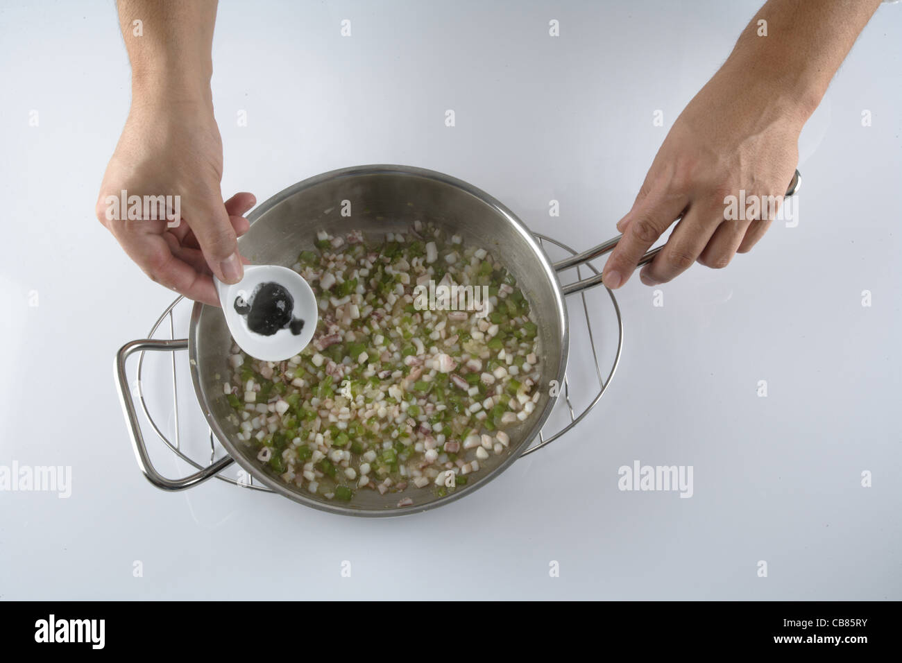 Adding squid ink Stock Photo - Alamy