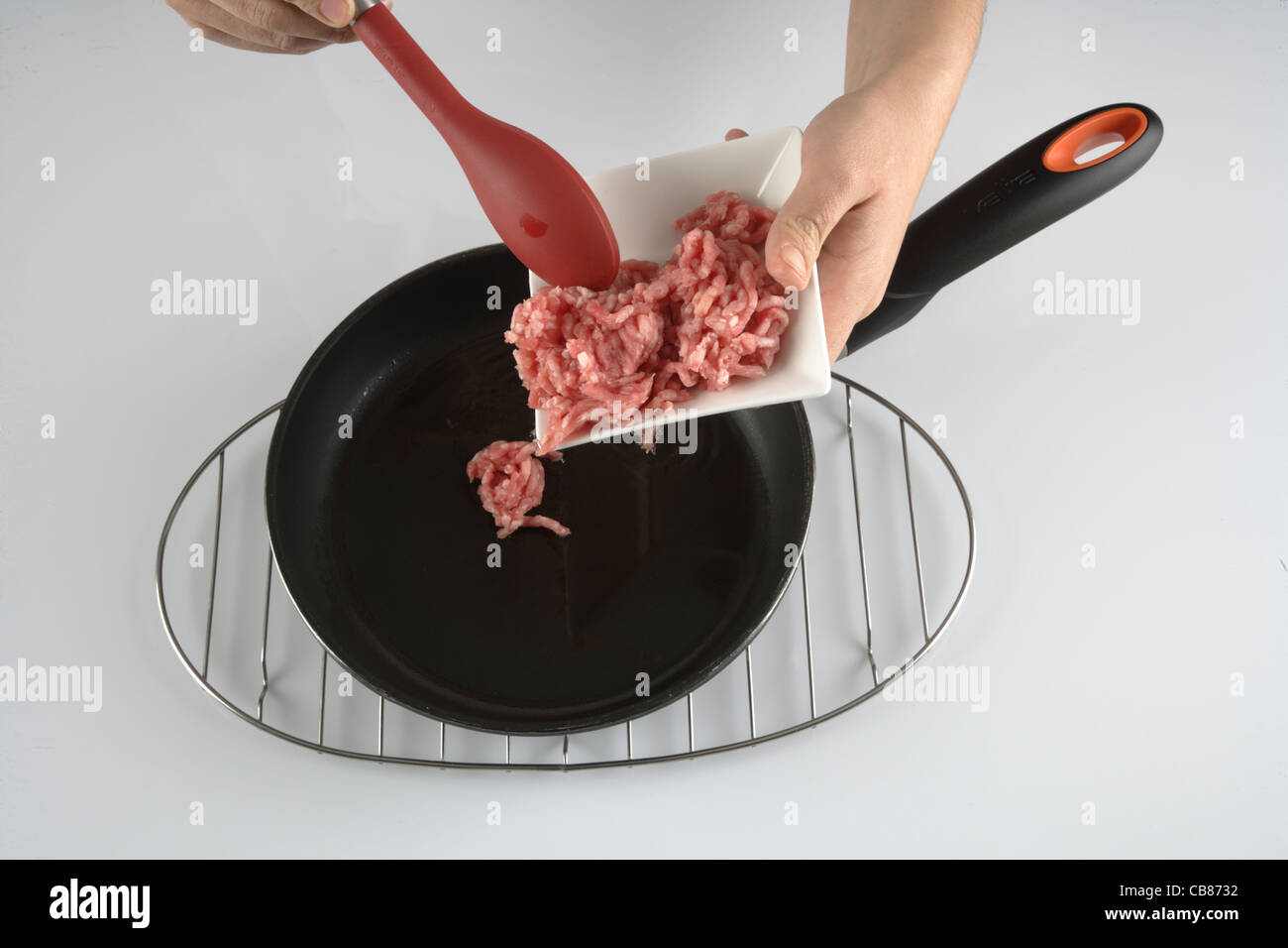 Sauteing chopped meat Stock Photo - Alamy