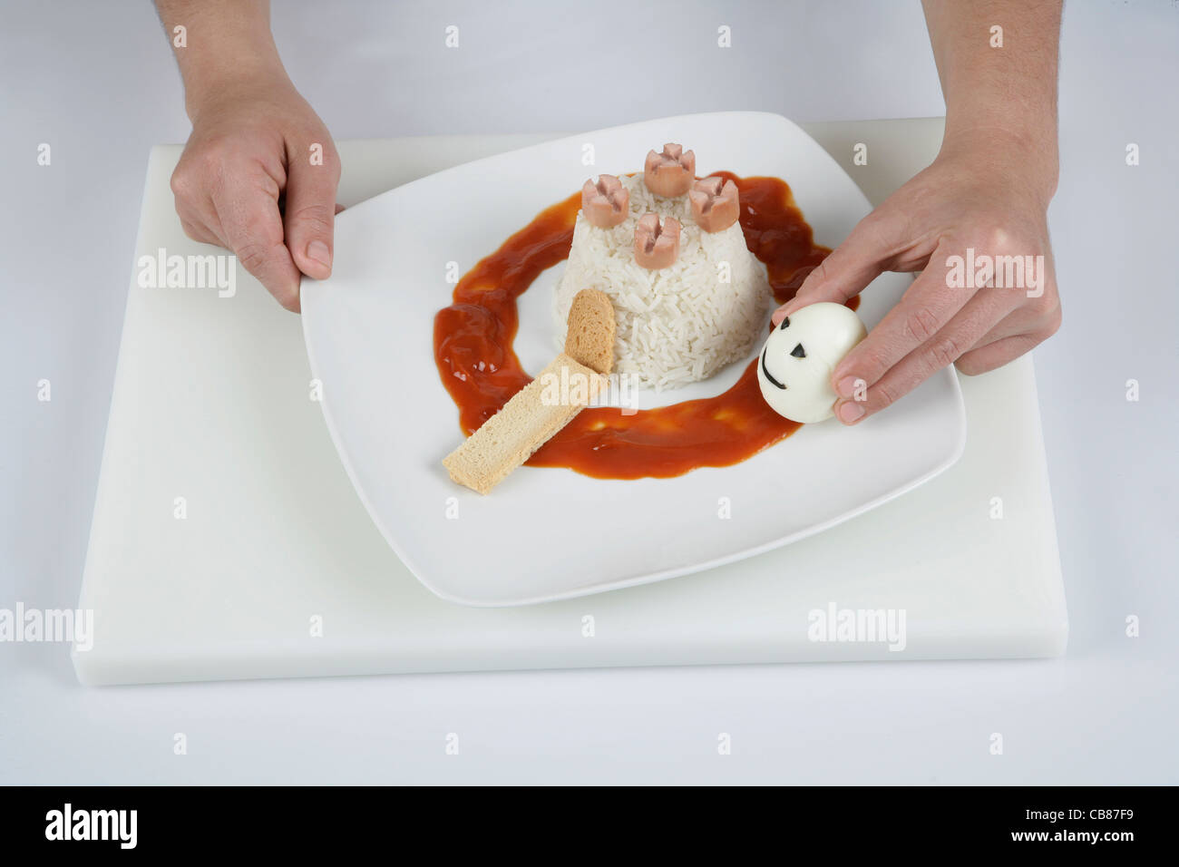 Rice castle, eggs, ketchup, sausage, children Stock Photo - Alamy