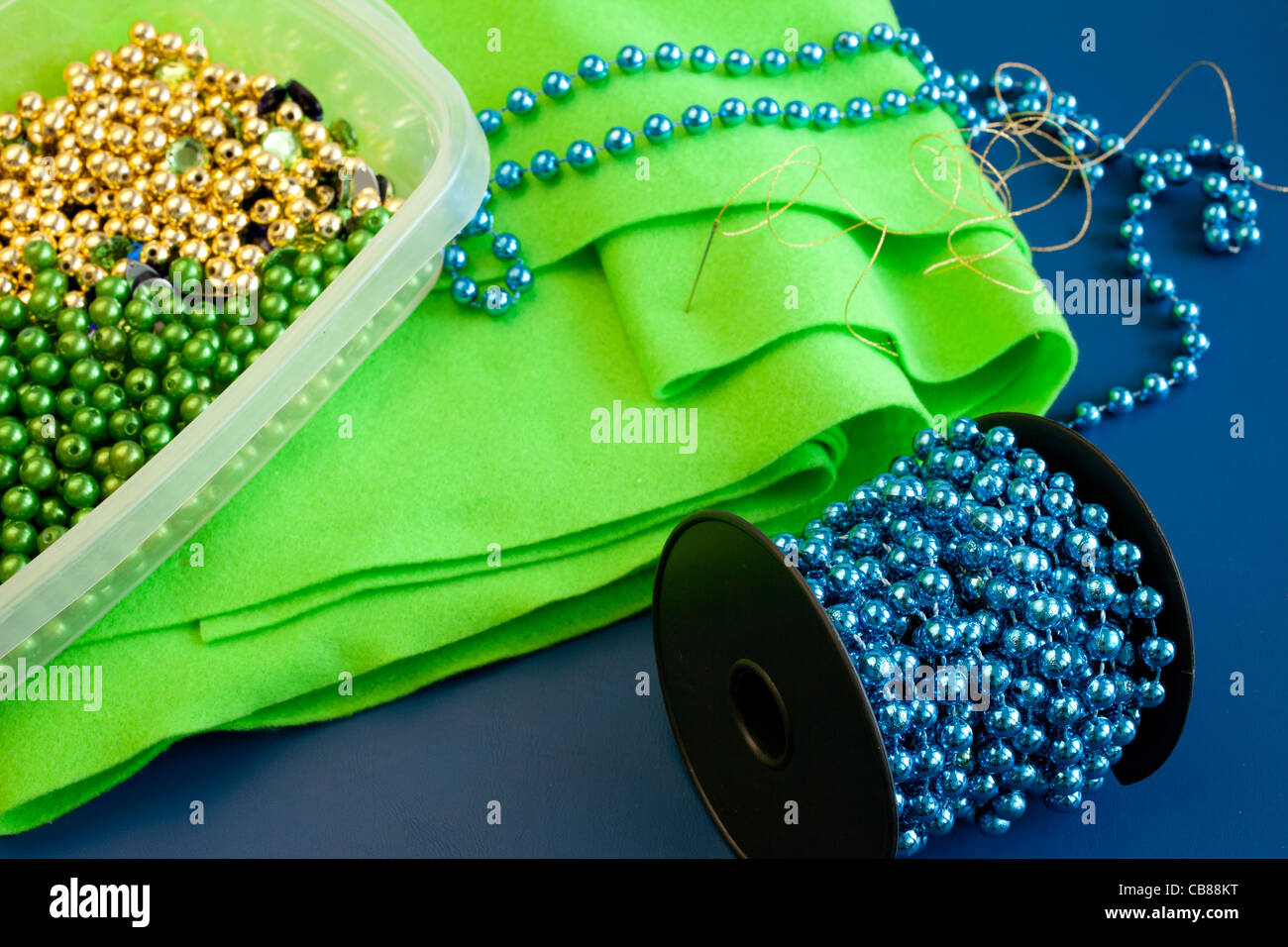 sewing with green felt Stock Photo - Alamy