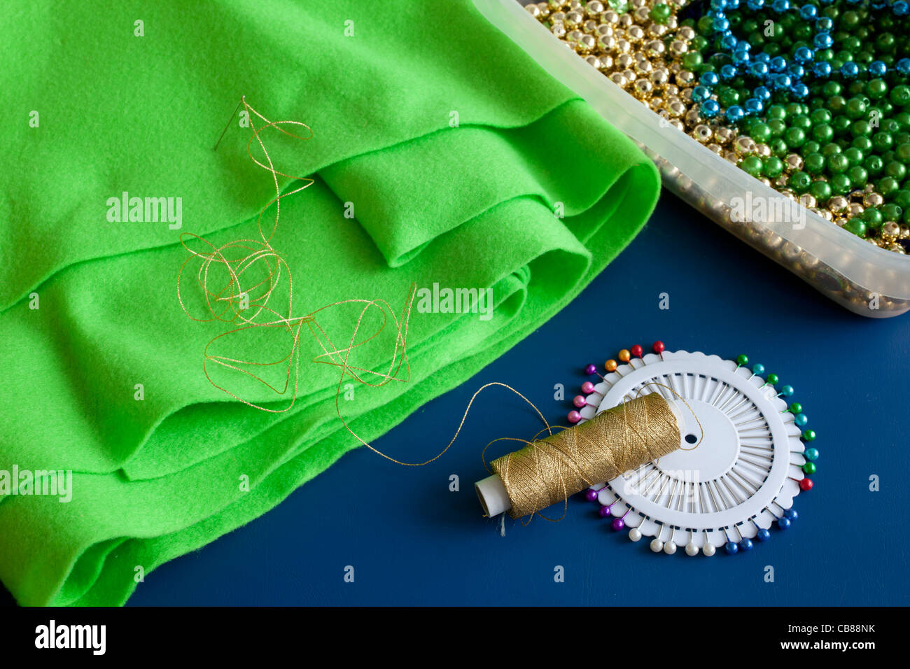 sewing with green felt Stock Photo - Alamy