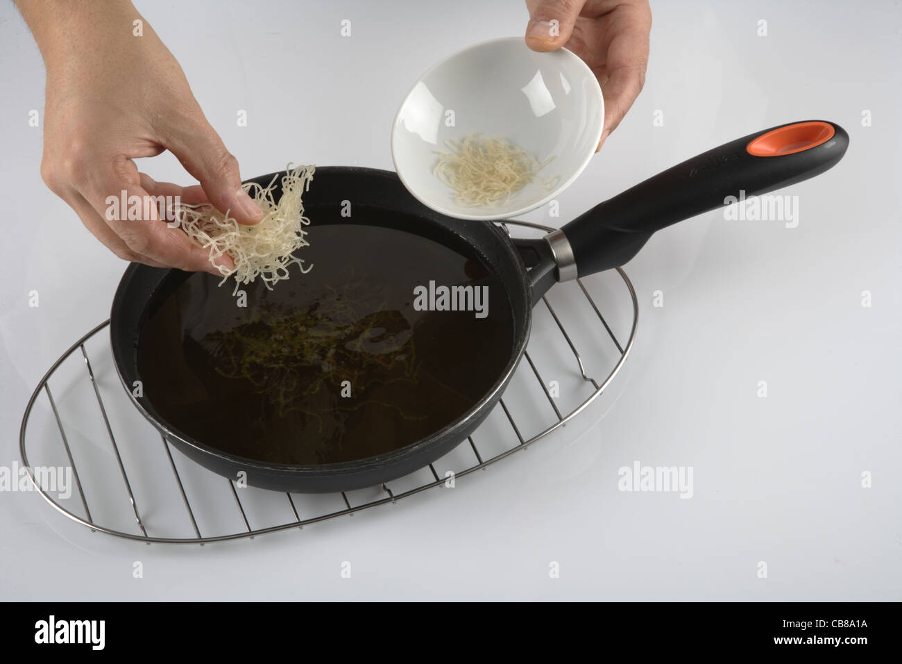 Frying rice noodles Stock Photo - Alamy
