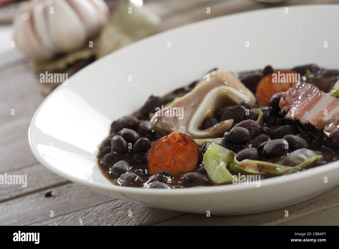 Tolosa beans with cabbage and pig ear Stock Photo - Alamy