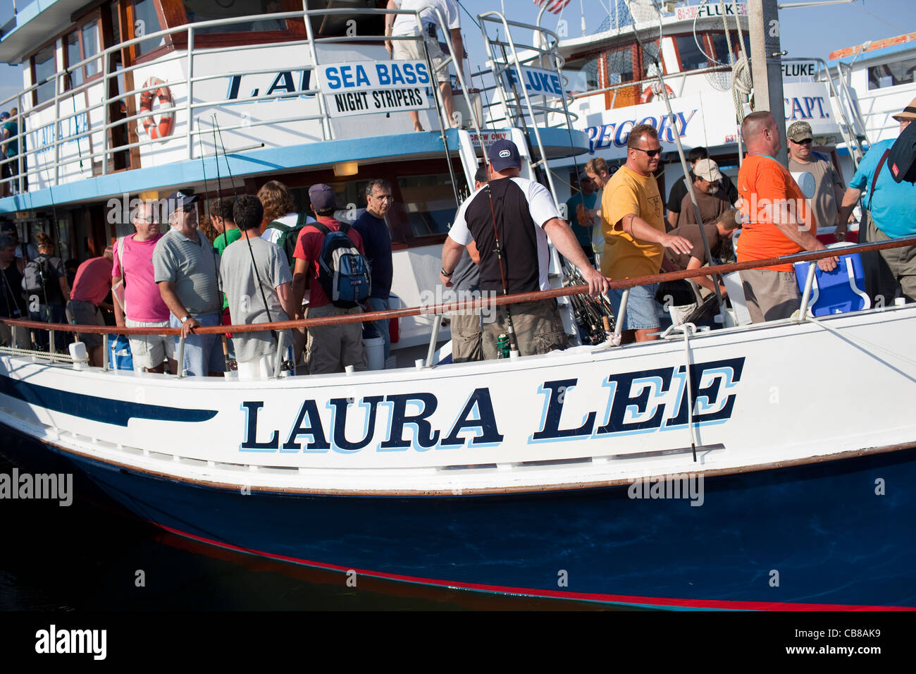 Fishermen disembark from the party boat "Laura Lee" after a mid ...