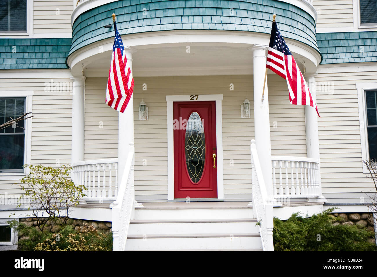Front porch of a house in the USA with American flags Stock Photo - Alamy