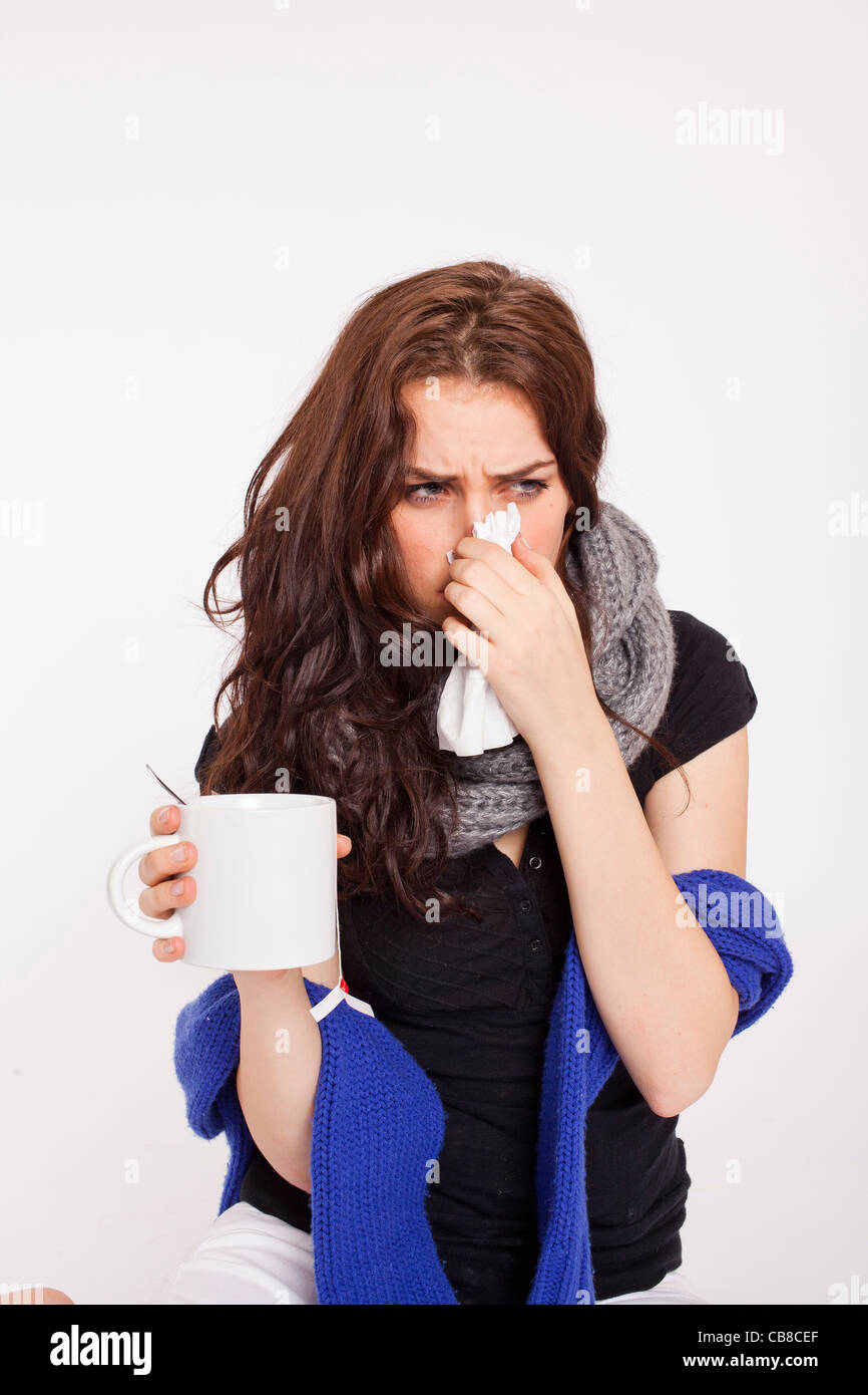 A beautiful young woman, lady, girl, cold, runny nose, headache ...