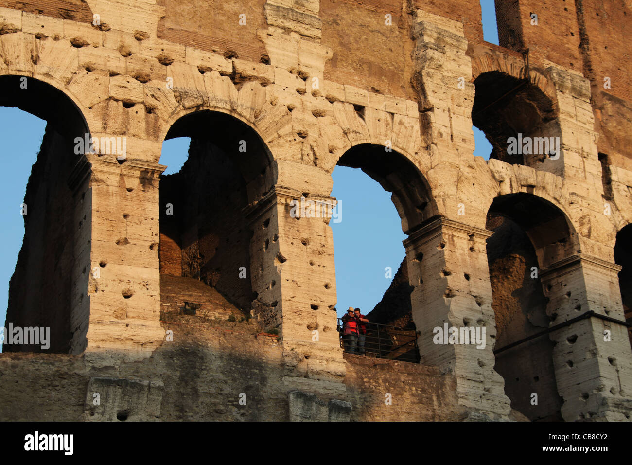Tourists looking out of the Colosseum in Rome Stock Photo - Alamy
