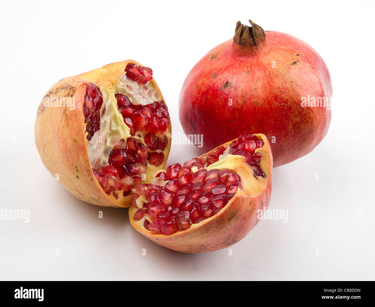 Pomegranate close up isolated on white background Stock Photo - Alamy