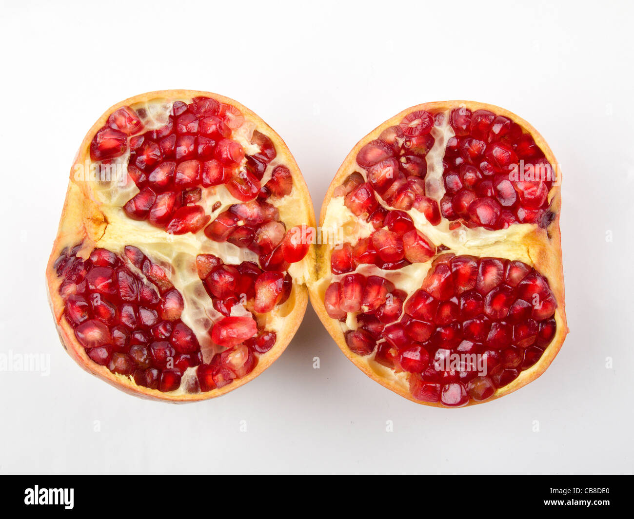 Pomegranate close up isolated on white background Stock Photo - Alamy