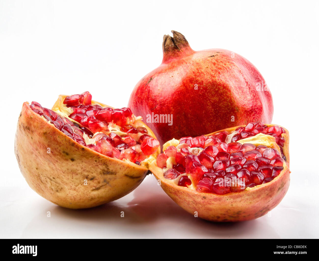 Pomegranate close up isolated on white background Stock Photo - Alamy