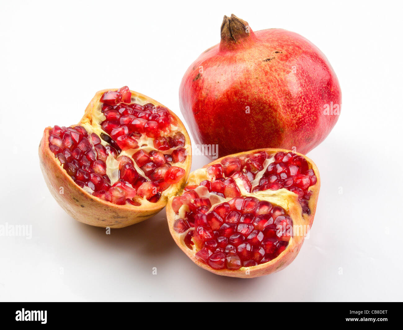 Pomegranate close up isolated on white background Stock Photo - Alamy