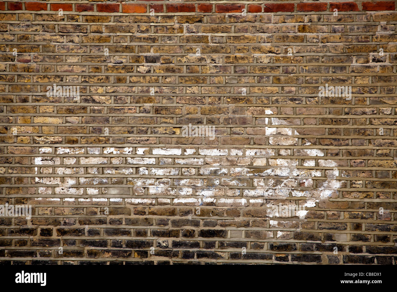 Arrow painted on Brick Wall Stock Photo - Alamy
