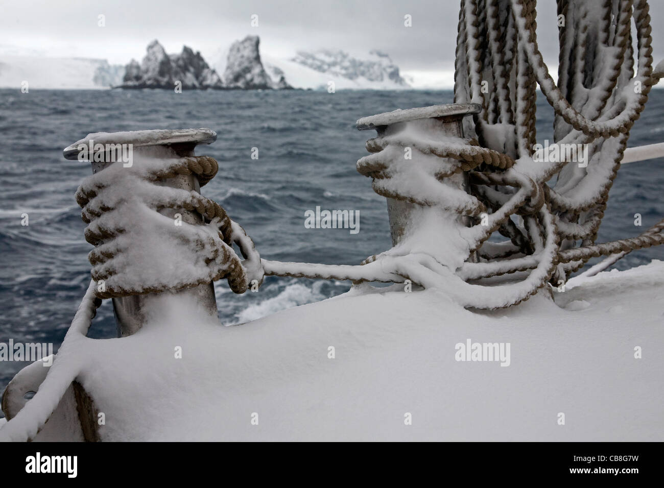 Ropes covered in snow on deck of the tallship Europa, a three-masted ...