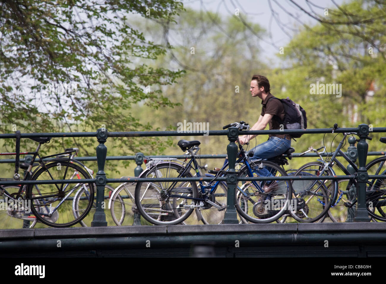 Bicycles crossing a bridge hi-res stock photography and images - Alamy